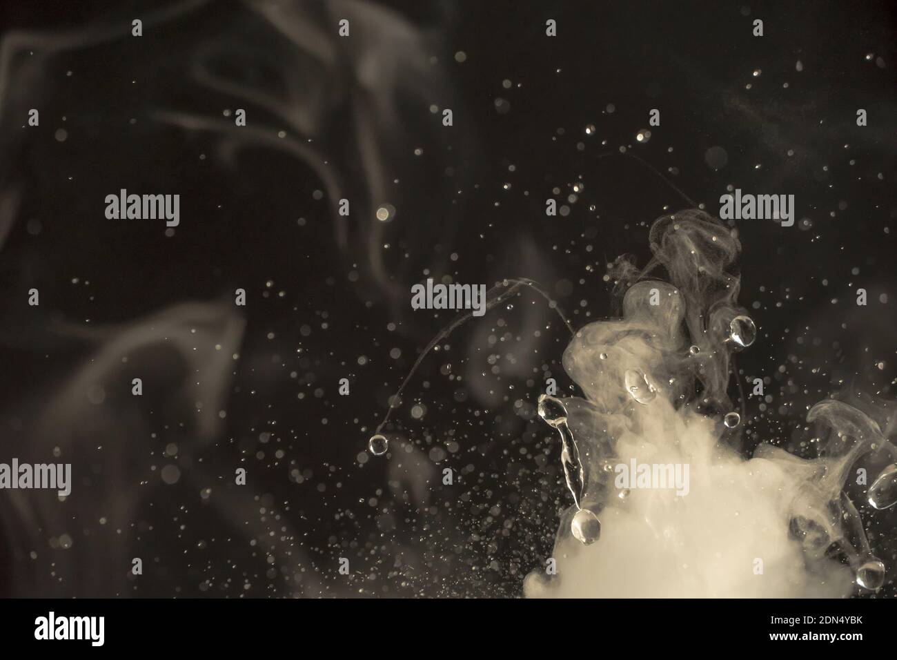 Water drop. Chemical reaction with boiling swirling water splashes ...