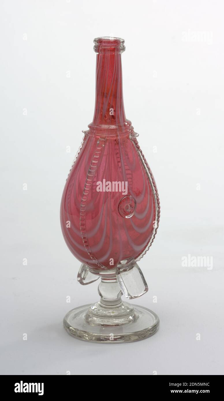 Bottle, glass, Footed bellows-form. Red rose glass with slight white ...