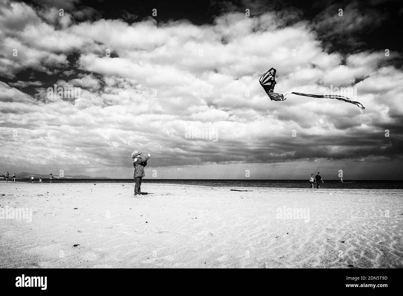Flying with kite Black and White Stock Photos & Images - Alamy