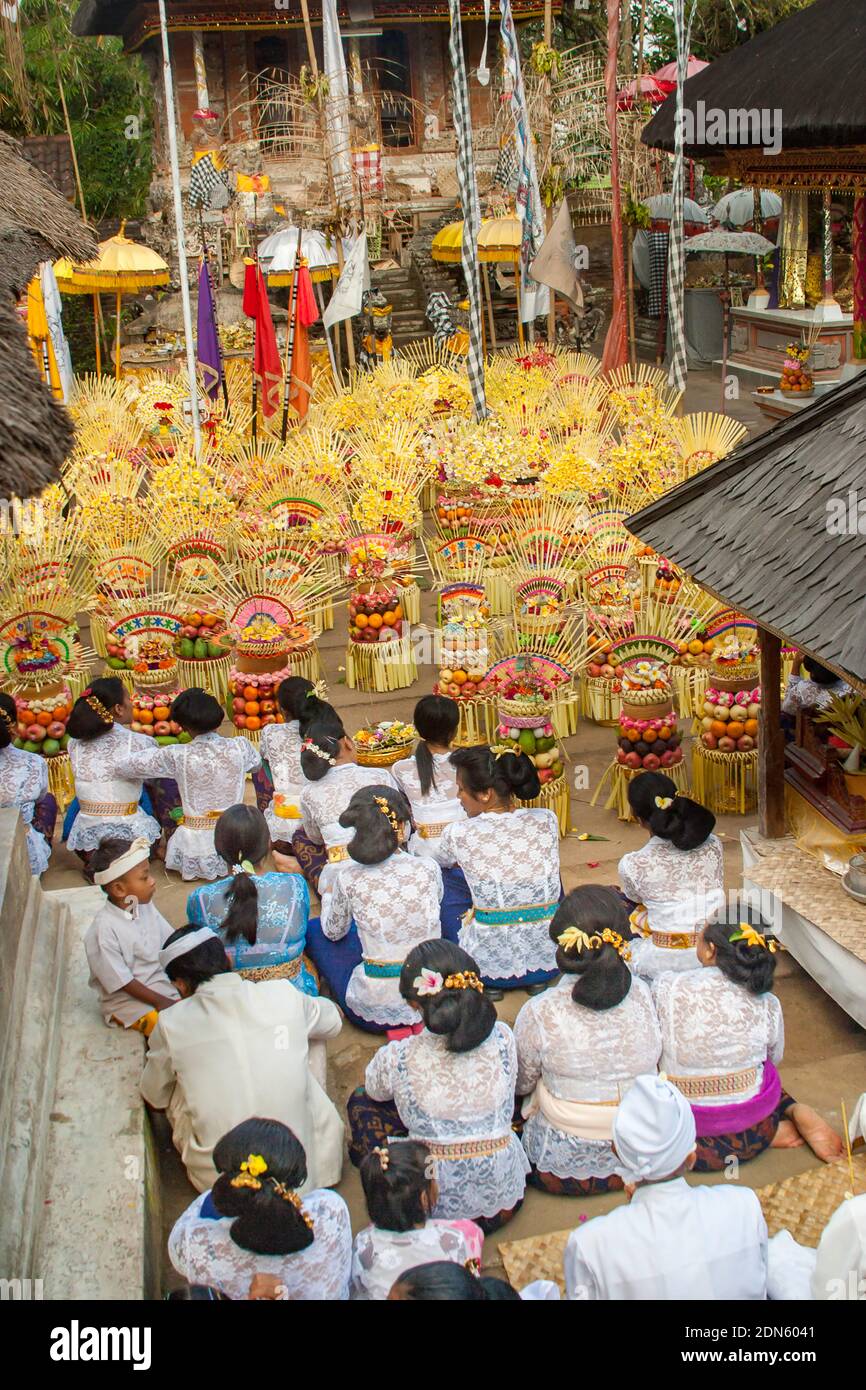 Balinese religious celebration inside a Hindu temple with decorations ...
