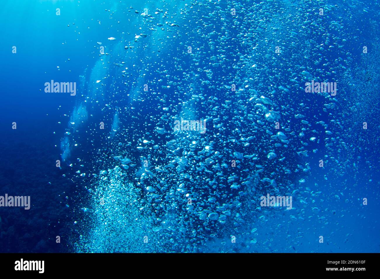 Bubbles rising through clear blue ocean water. Hawaii Stock Photo - Alamy