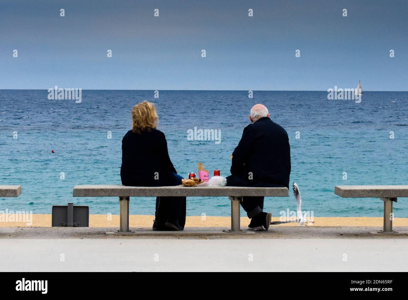 Elderly woman sitting rear view bench hi-res stock photography and ...