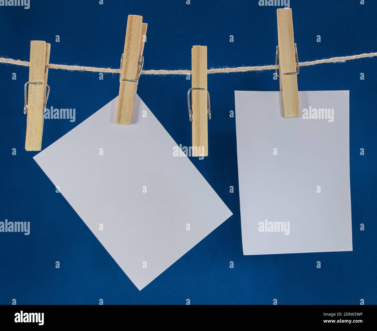 A closeup shot of an horizontal and vertical notes hanged by clothes ...