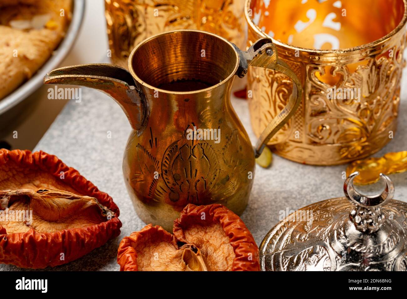 Arabic metal dishware and dry fruits on table Stock Photo - Alamy