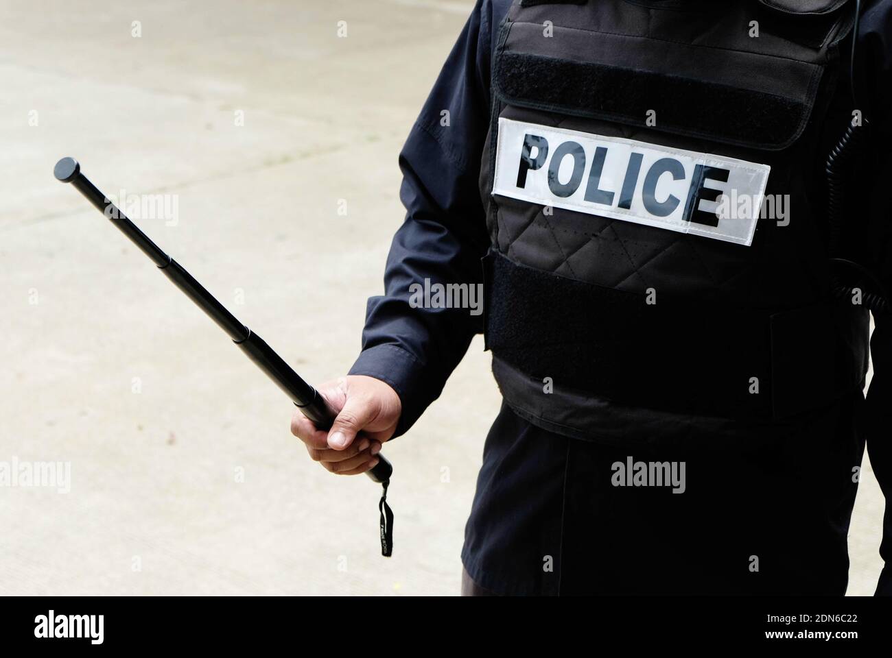 Policeman holding weapon hi-res stock photography and images - Alamy