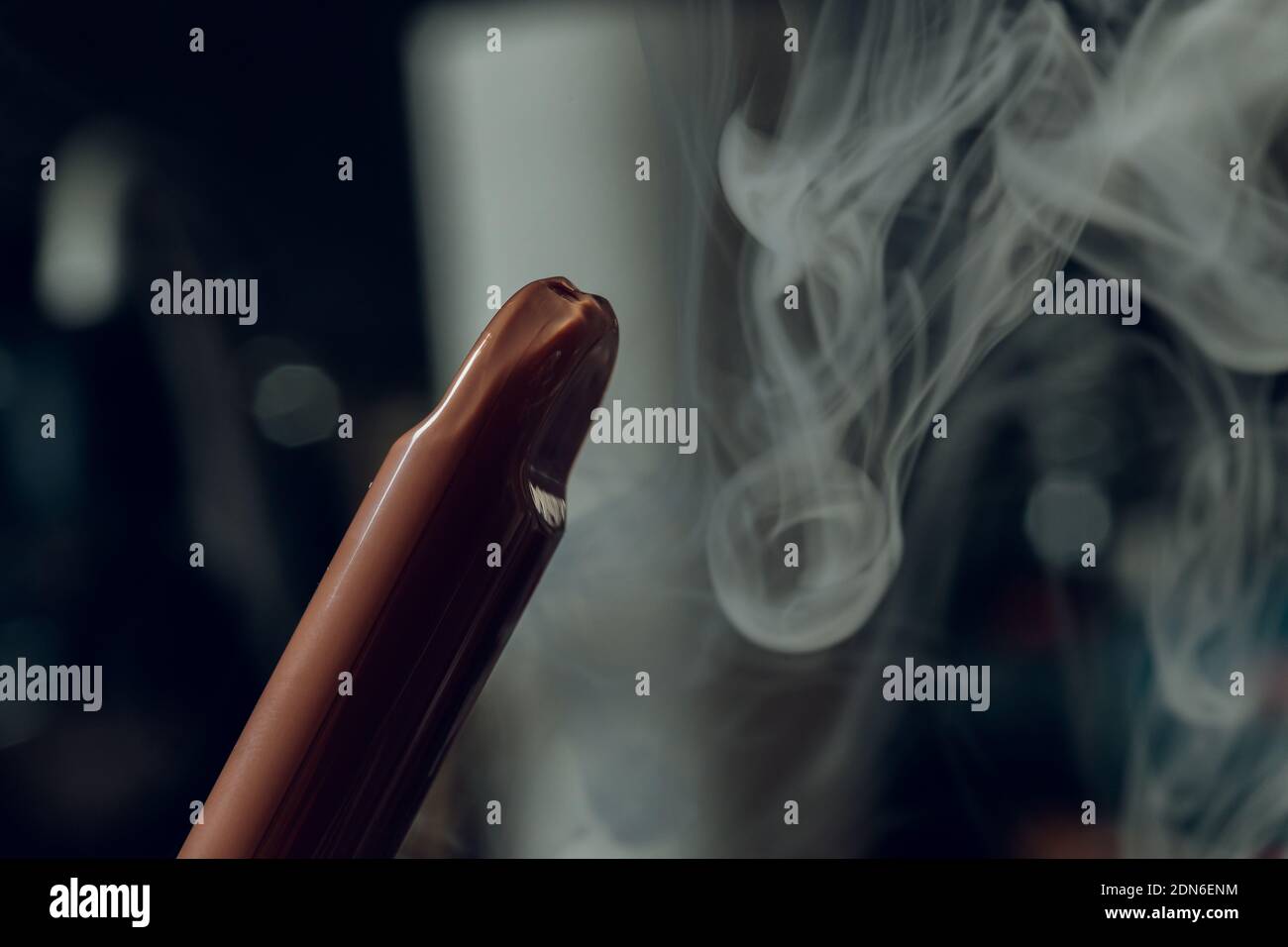 Man smokes new Vape Pod System, inhales and exhales vapor of electronic ...