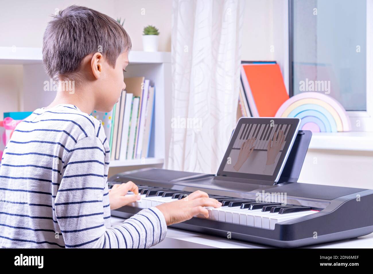 Online learning, remote education. Teenage boy watching video tutorial ...