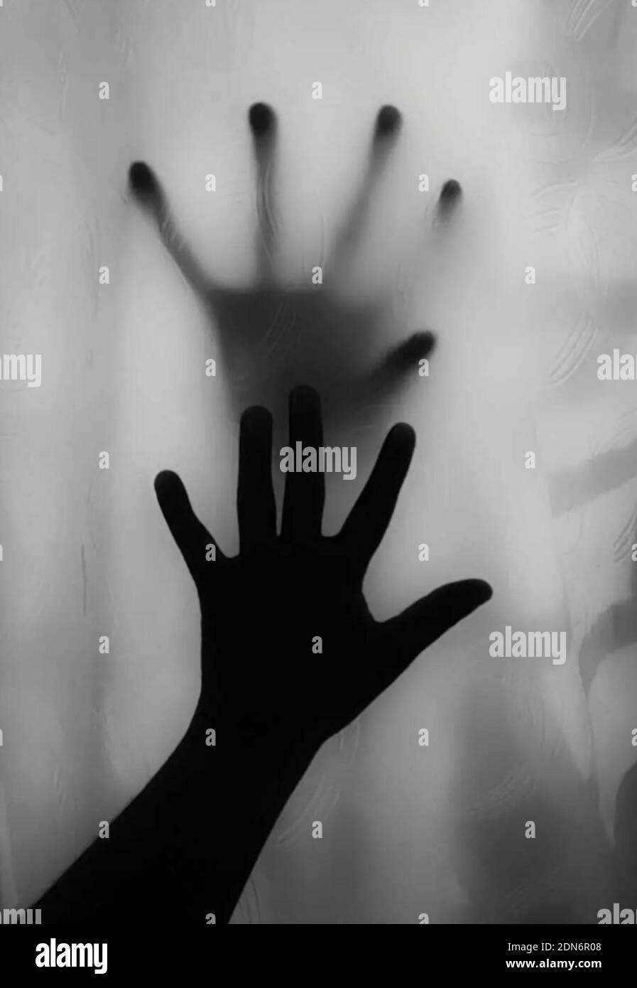 Hands behind frosted glass hi-res stock photography and images - Alamy