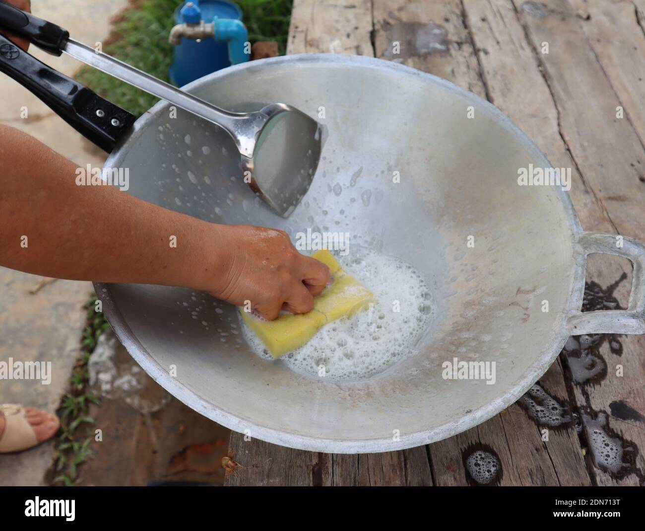 Women Washing Utensils High Resolution Stock Photography and Images - Alamy