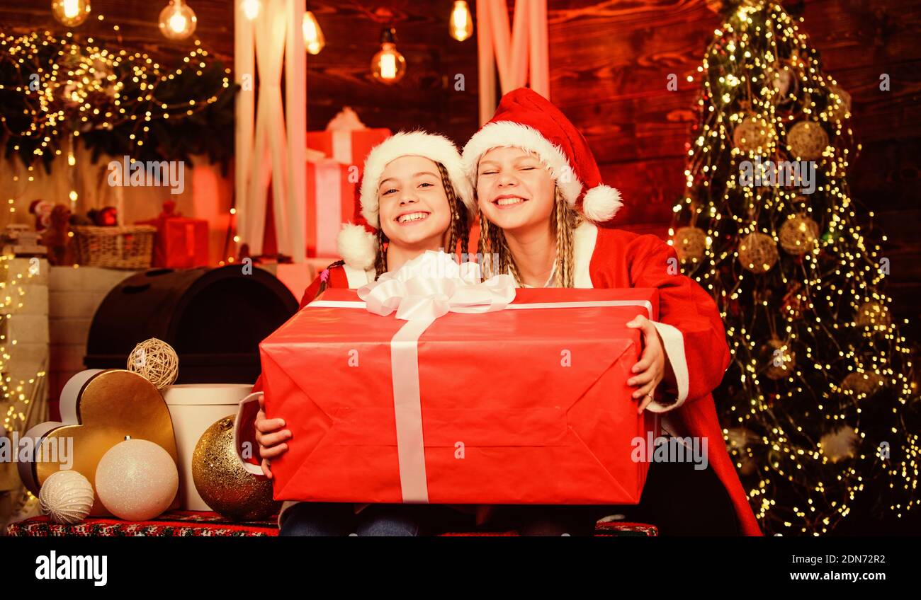 Winter masquerade. Happiness and joy. Girls friends sisters Santa claus ...