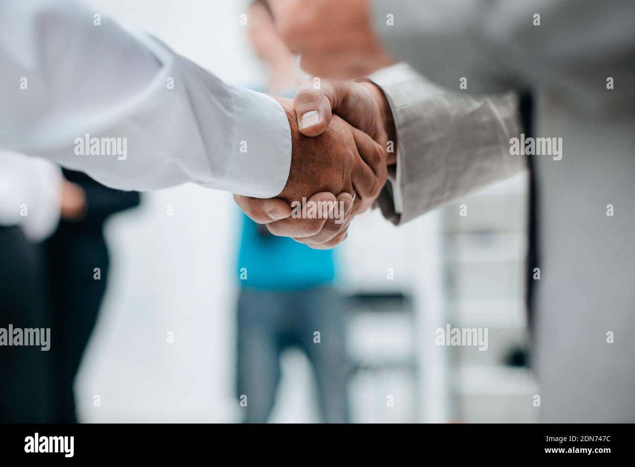 close up. business handshake on office background Stock Photo - Alamy