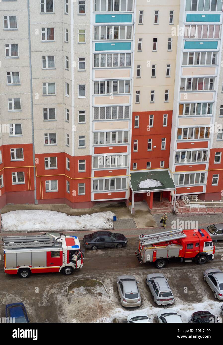 Fire engine in the courtyard of a multi-storey residential building in ...
