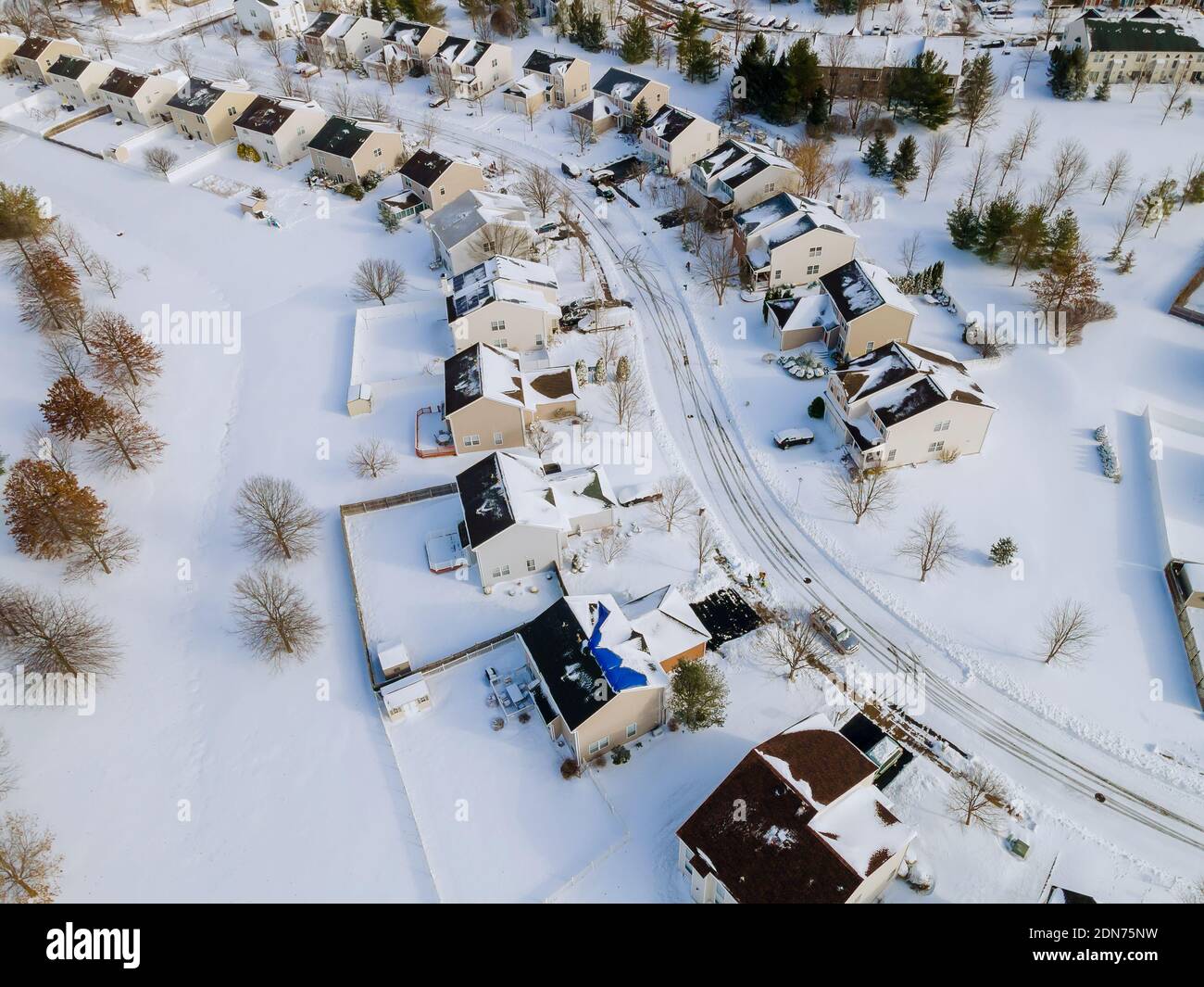 Aerial view of residential houses covered snow with snow on covered ...