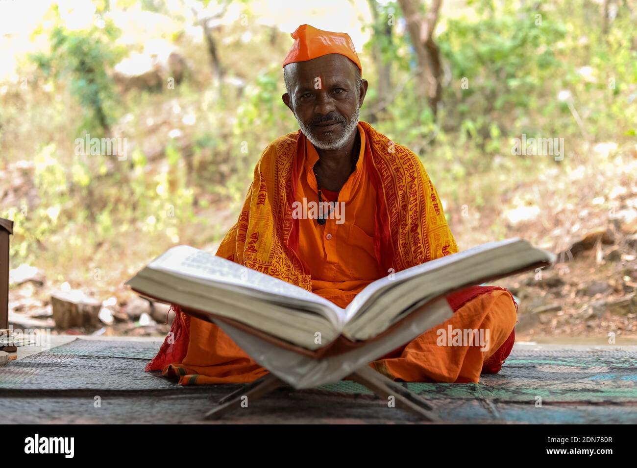 Portrait Of Sadhu Sitting By Bhagavad Gita Stock Photo - Alamy