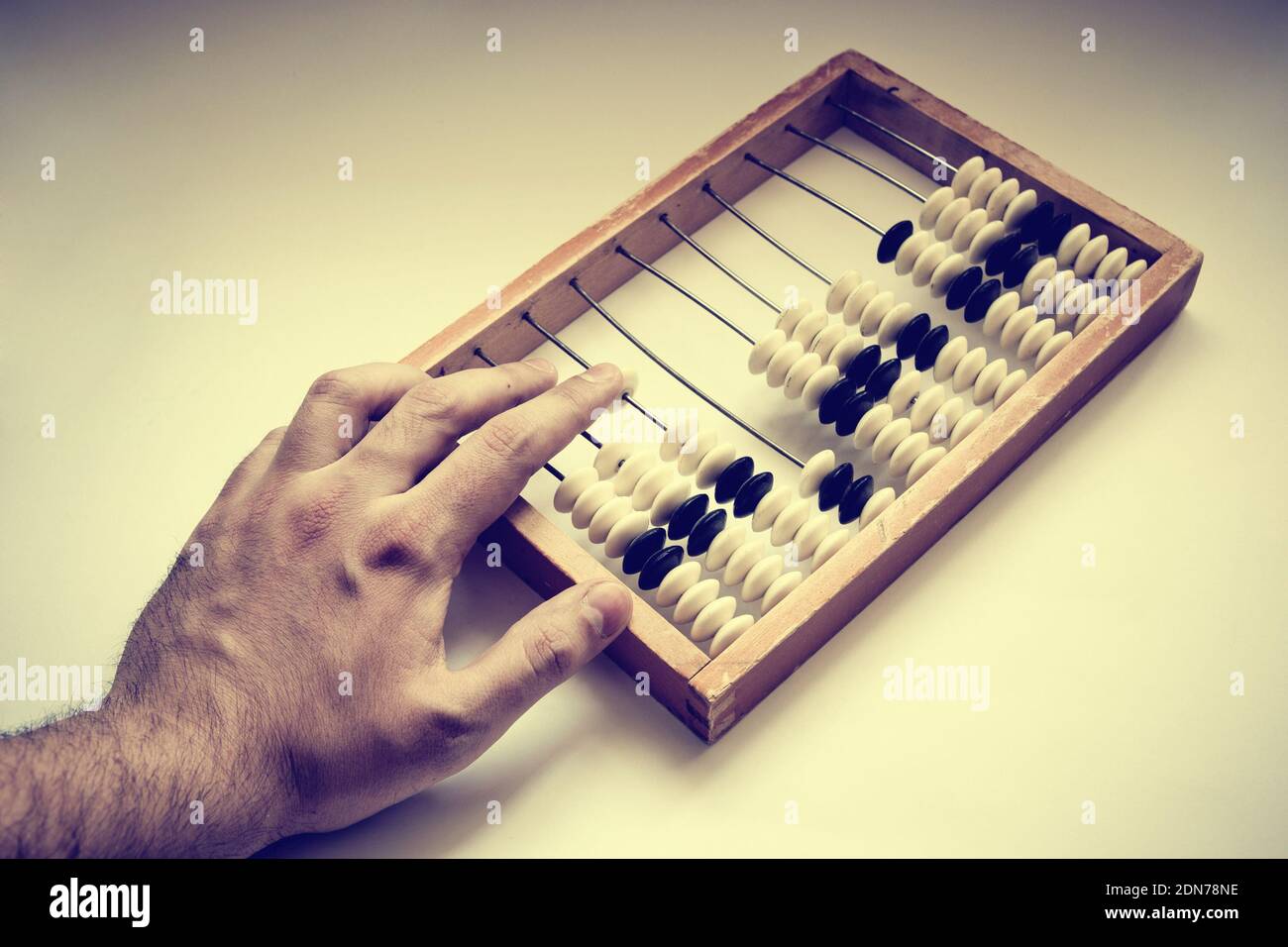 old abacus with human hand Stock Photo - Alamy