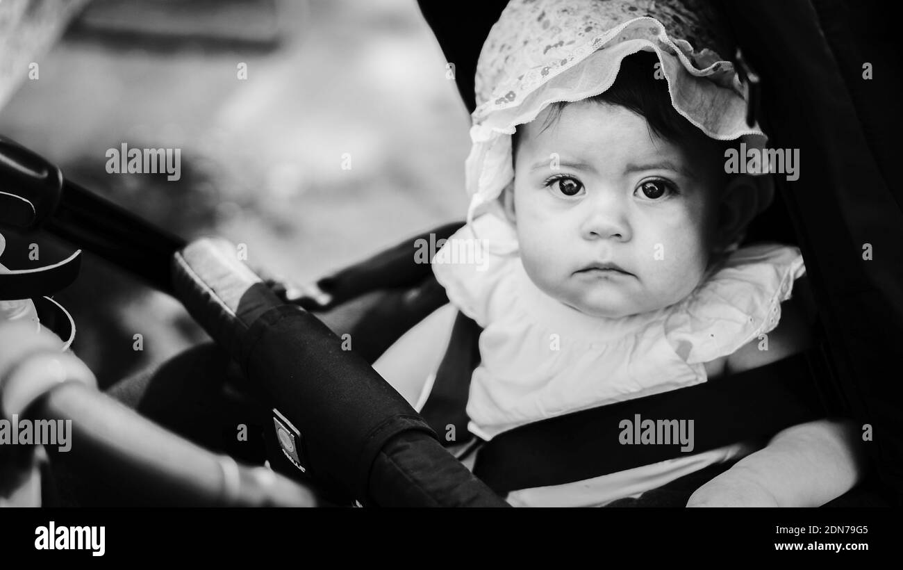 Portrait Of Cute Baby Girl In Stroller Stock Photo - Alamy