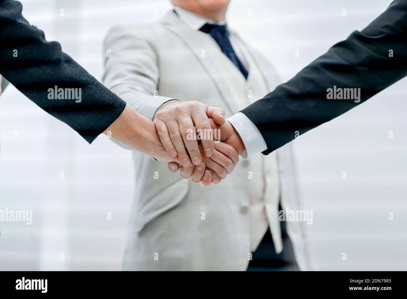 close up. business people putting their hands together Stock Photo - Alamy