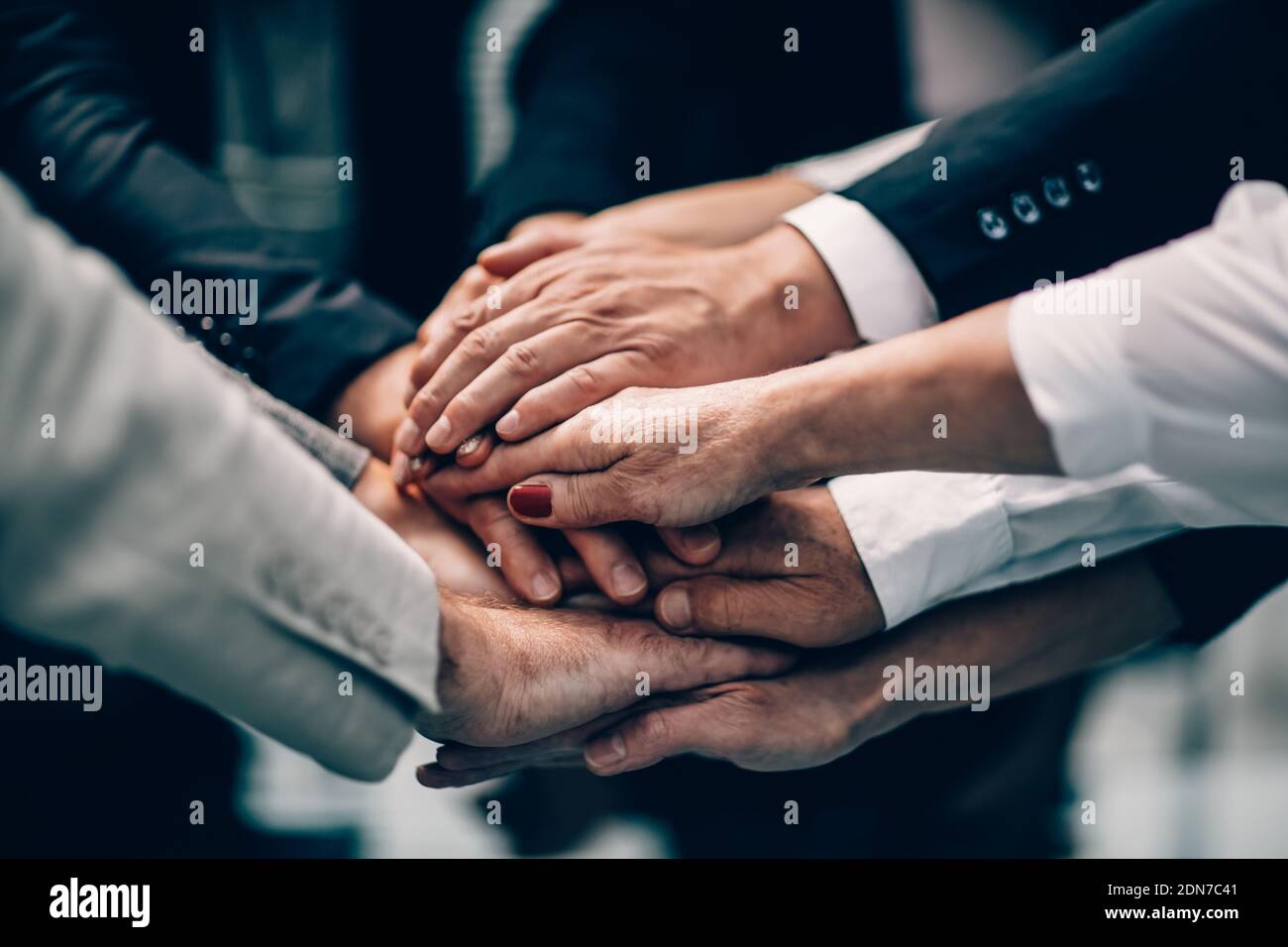 close up. a stack of hands. the concept of unity Stock Photo - Alamy