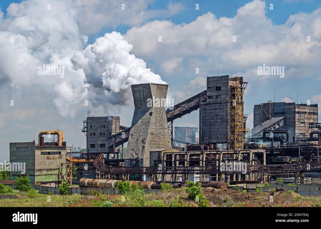 Outdated manufacturing coke plant on a cloudy sky background on sunny ...