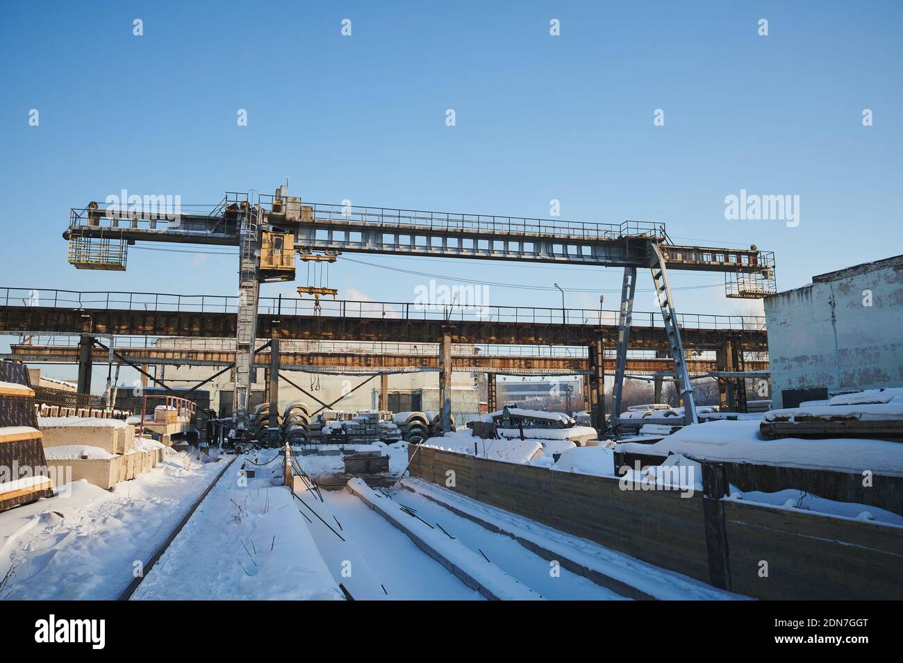 Row of reinforced concrete foundations with metal anchor bolts designed ...