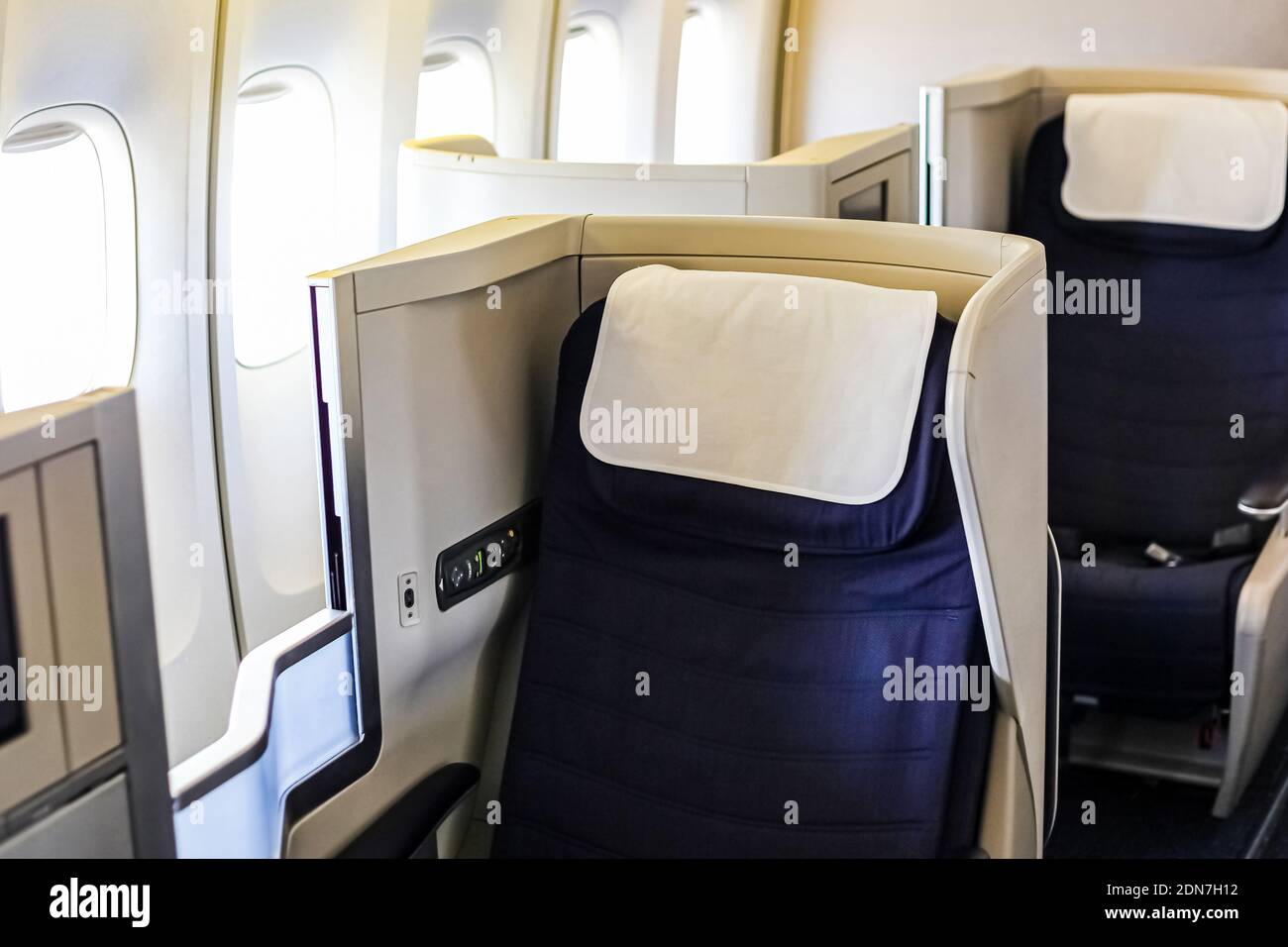 Empty 1st business class seats on the airplane Stock Photo - Alamy