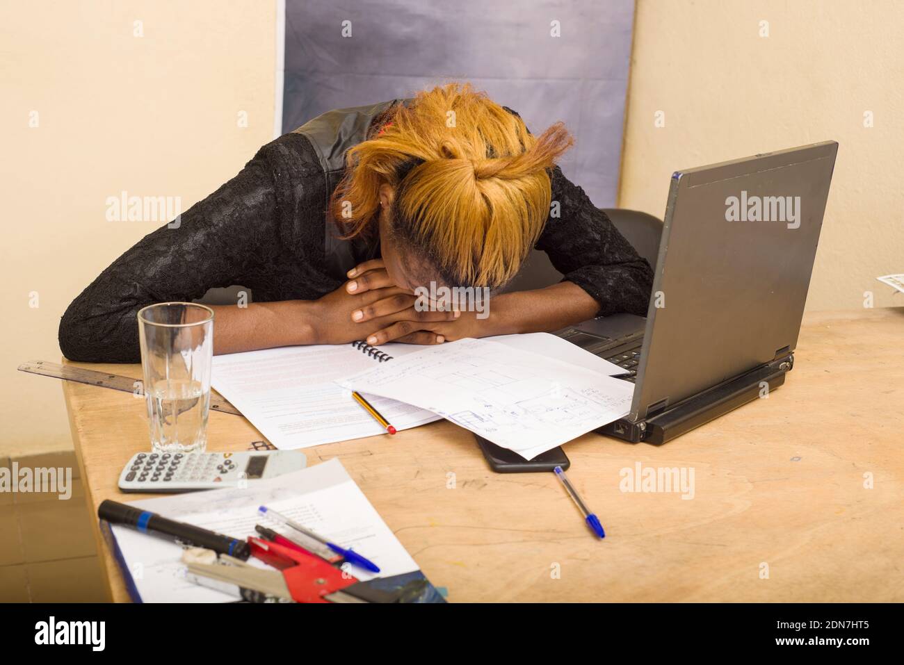 Tired businesswoman lying on table hi-res stock photography and images ...