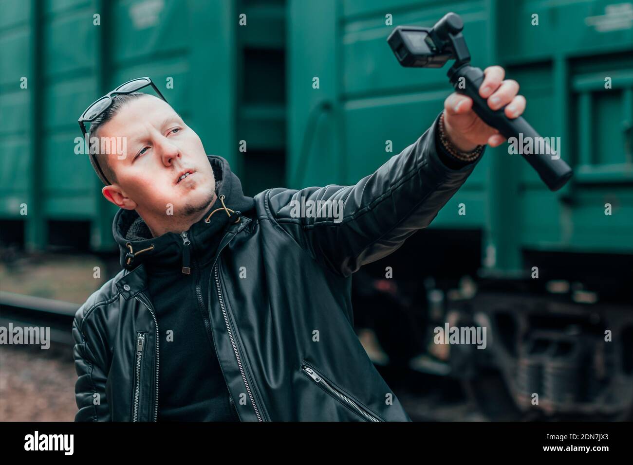 Handsome Guy in Black Clothes and Sunglasses Making Selfie or Streaming ...
