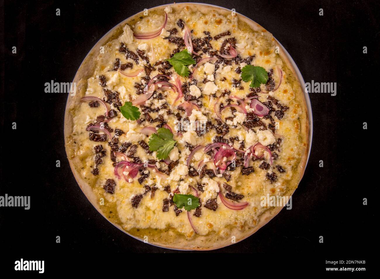 Mexican style pizza with fresh cheese, onion and cilantro Stock Photo ...