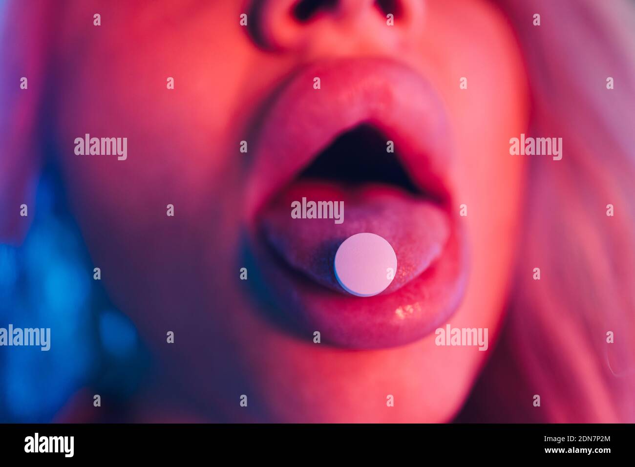 beautiful girl with lsd on tongue in nightclub with pink smoke Stock ...
