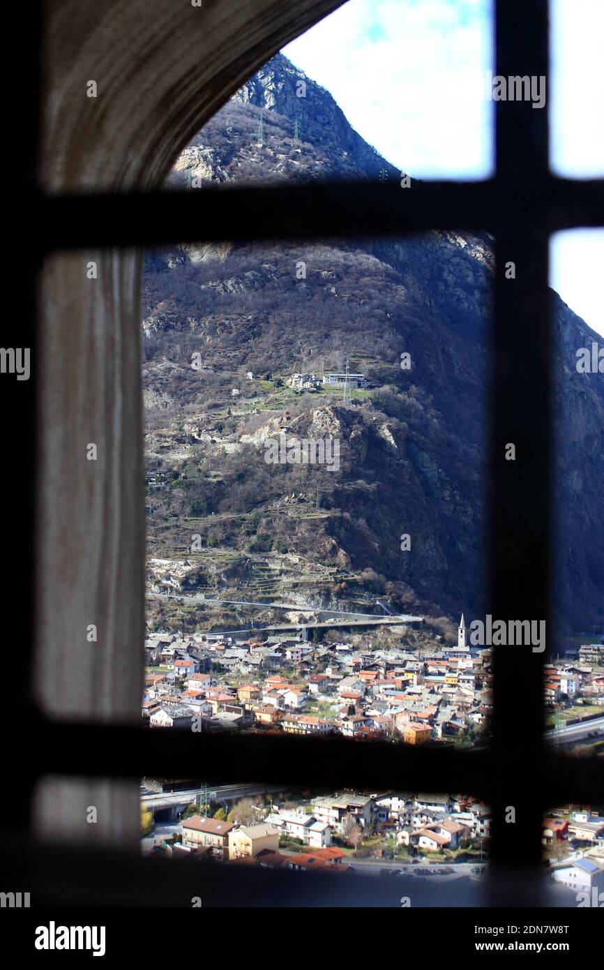 mountain panorama from the grate of a castle window, Italian Alps Stock ...