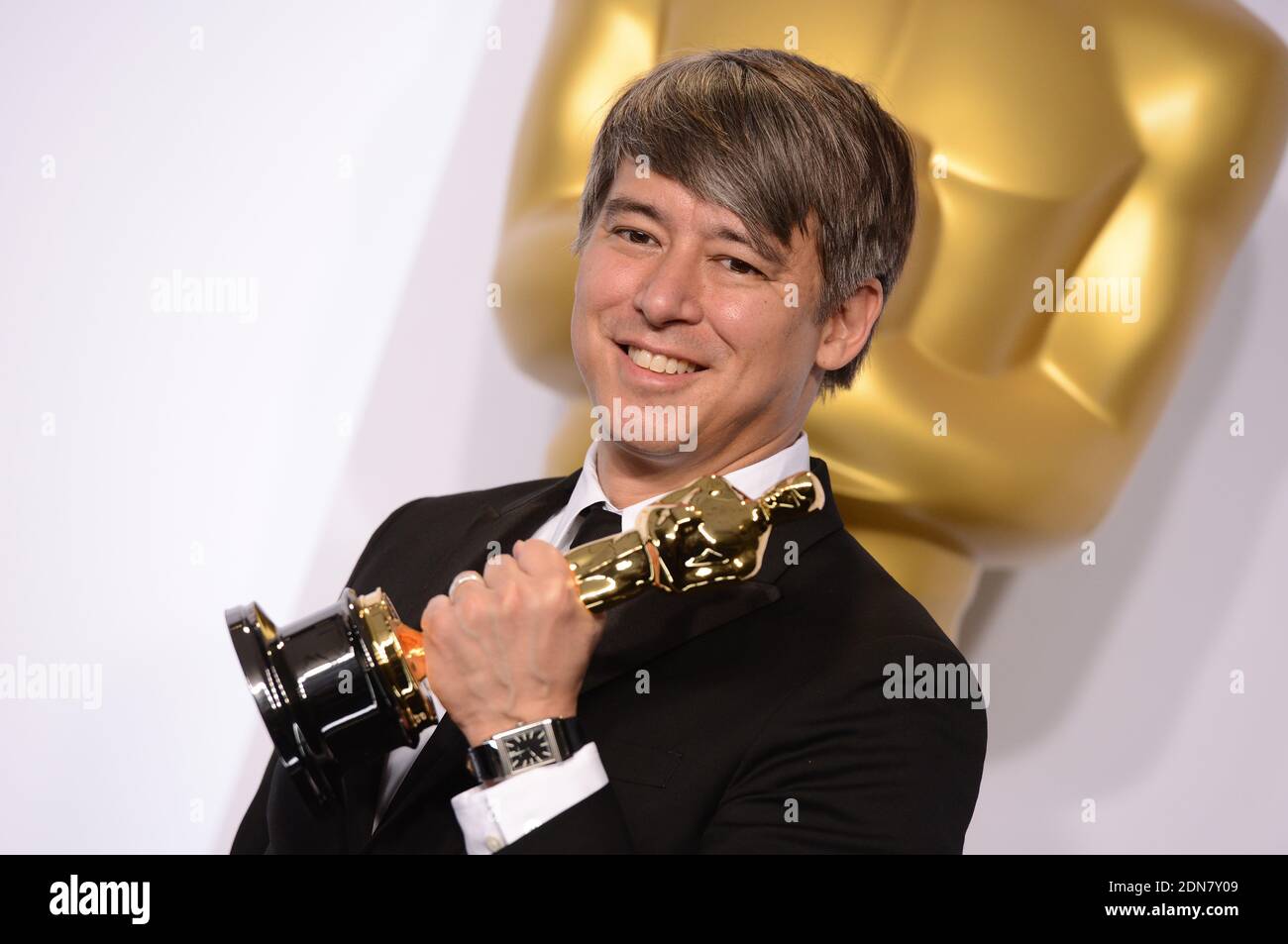 Tom Cross poses in the press room during the 87th Annual Academy Awards ...