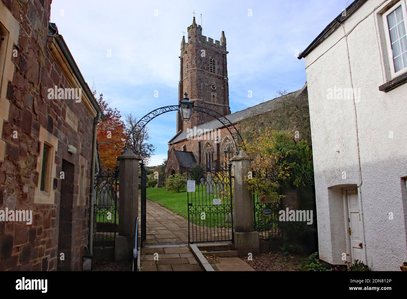 The wrought iron gateway leading to St Disen's Church in Bradninch ...