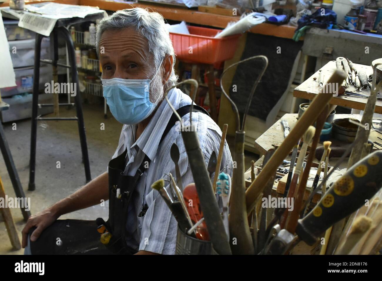 TEPOZTLAN, MEXICO - DECEMBER 13, 2020: Guatemalan sculptor Edgar Guzman ...