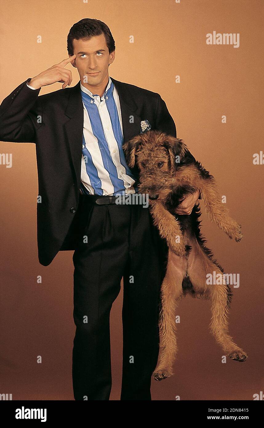 File Photo of TV anchor Christophe Dechavanne posing with his dog in ...
