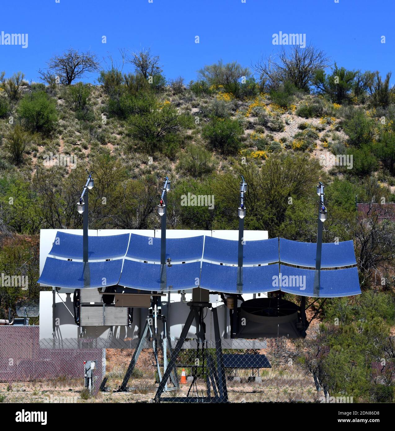 A row of modern solar panels places in nature Stock Photo - Alamy