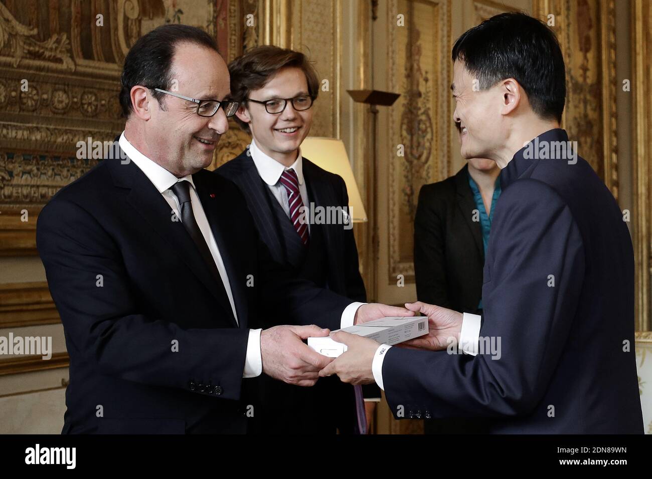 French President Francois Hollande flanked by his Special Advisor for ...