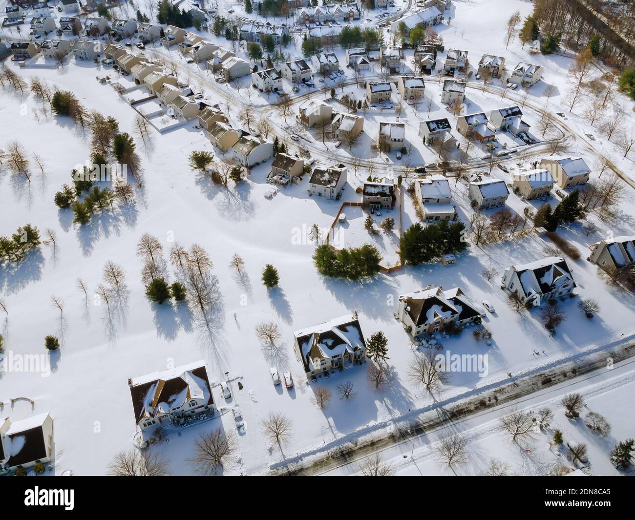 Aerial panorama view of snowed in traditional housing suburbs in snow ...