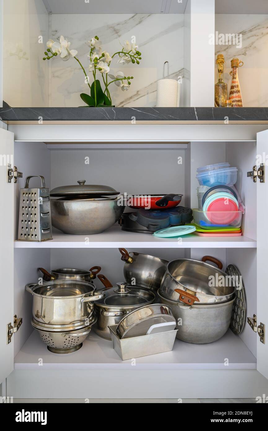Closeup to modern kitchen cabinet content Stock Photo - Alamy