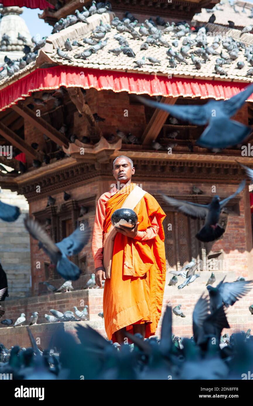 Tibetan monk among pigeons, Durbar Square, Kathmandu, Nepal Stock Photo ...
