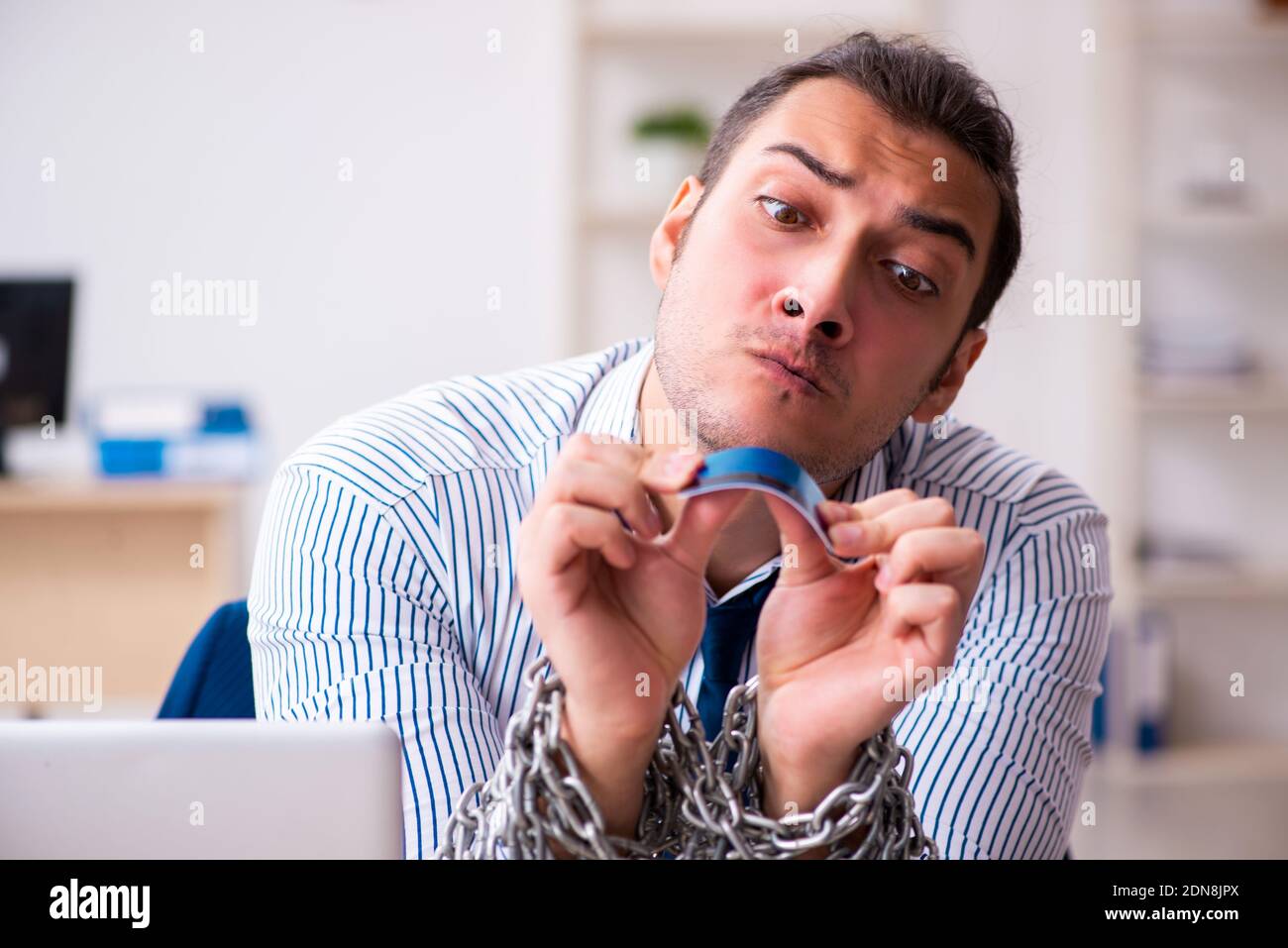 Man chained office hi-res stock photography and images - Alamy