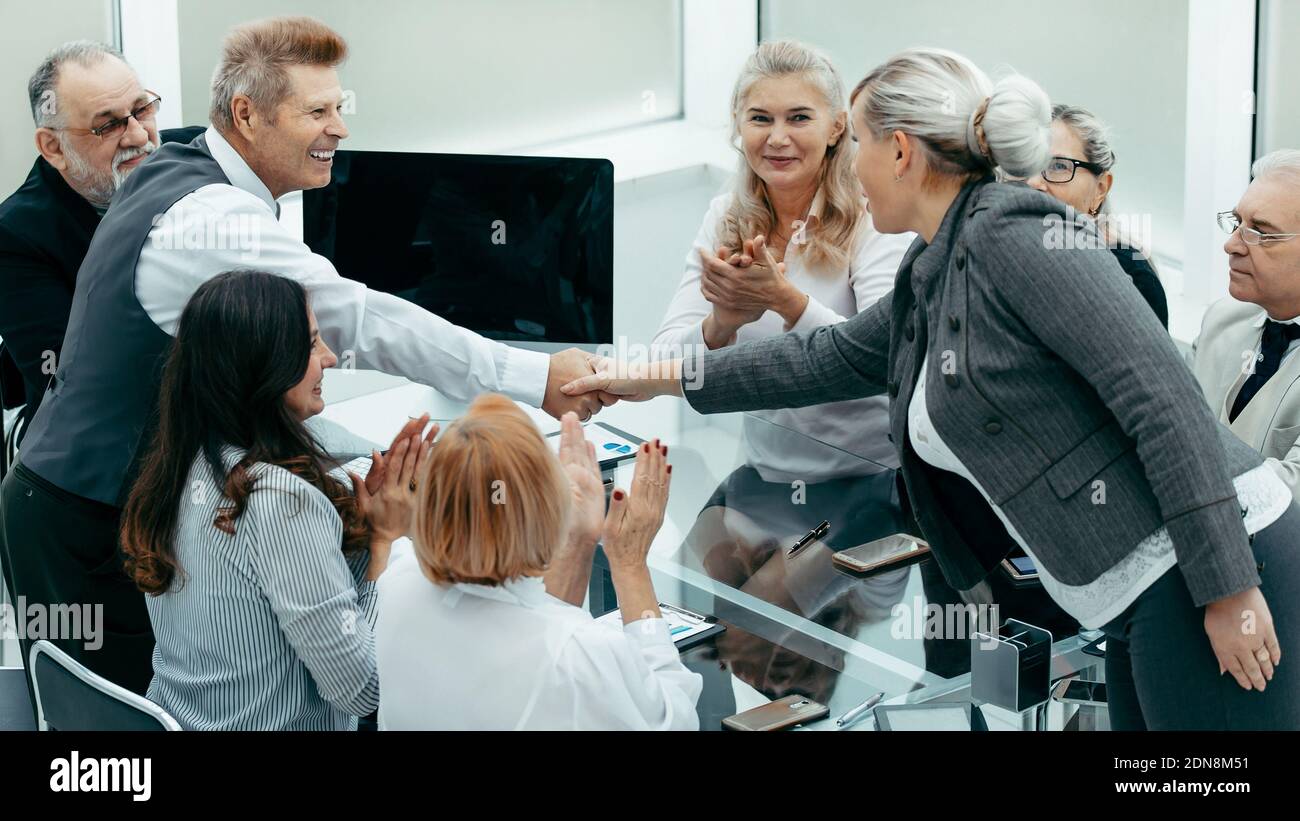 Women handshake in meeting hi-res stock photography and images - Alamy
