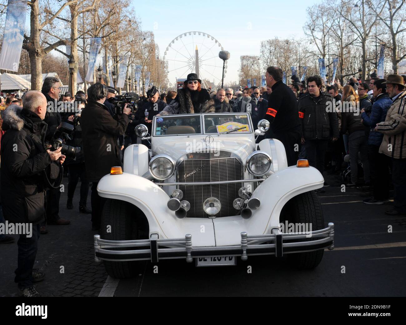 French singer Regine waves to the crowd during a parade in the Champs ...