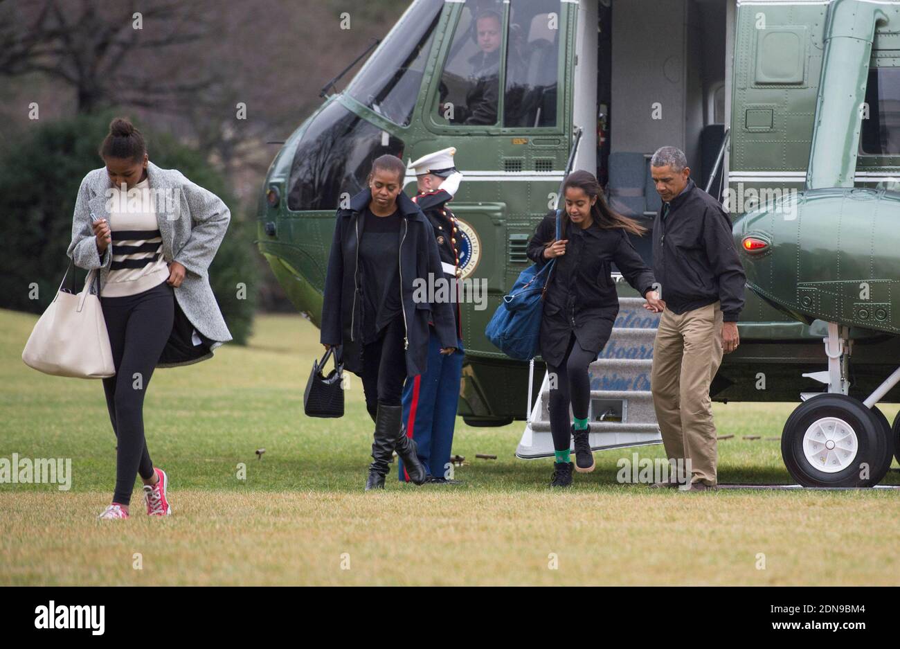 President Barack Obama, his wife Michelle Obama (C) and their daughters ...