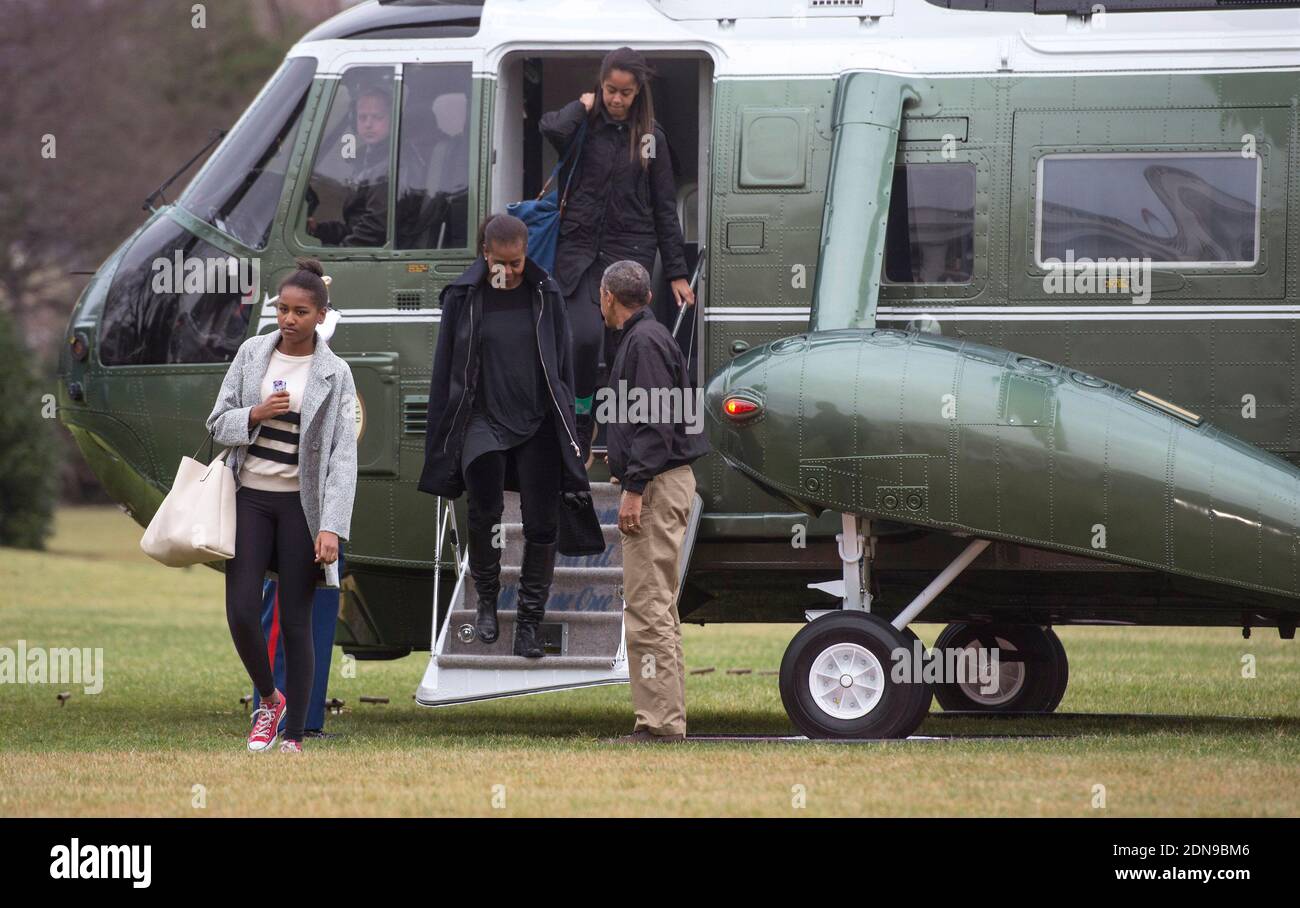 President Barack Obama, his wife Michelle Obama (C) and their daughters ...