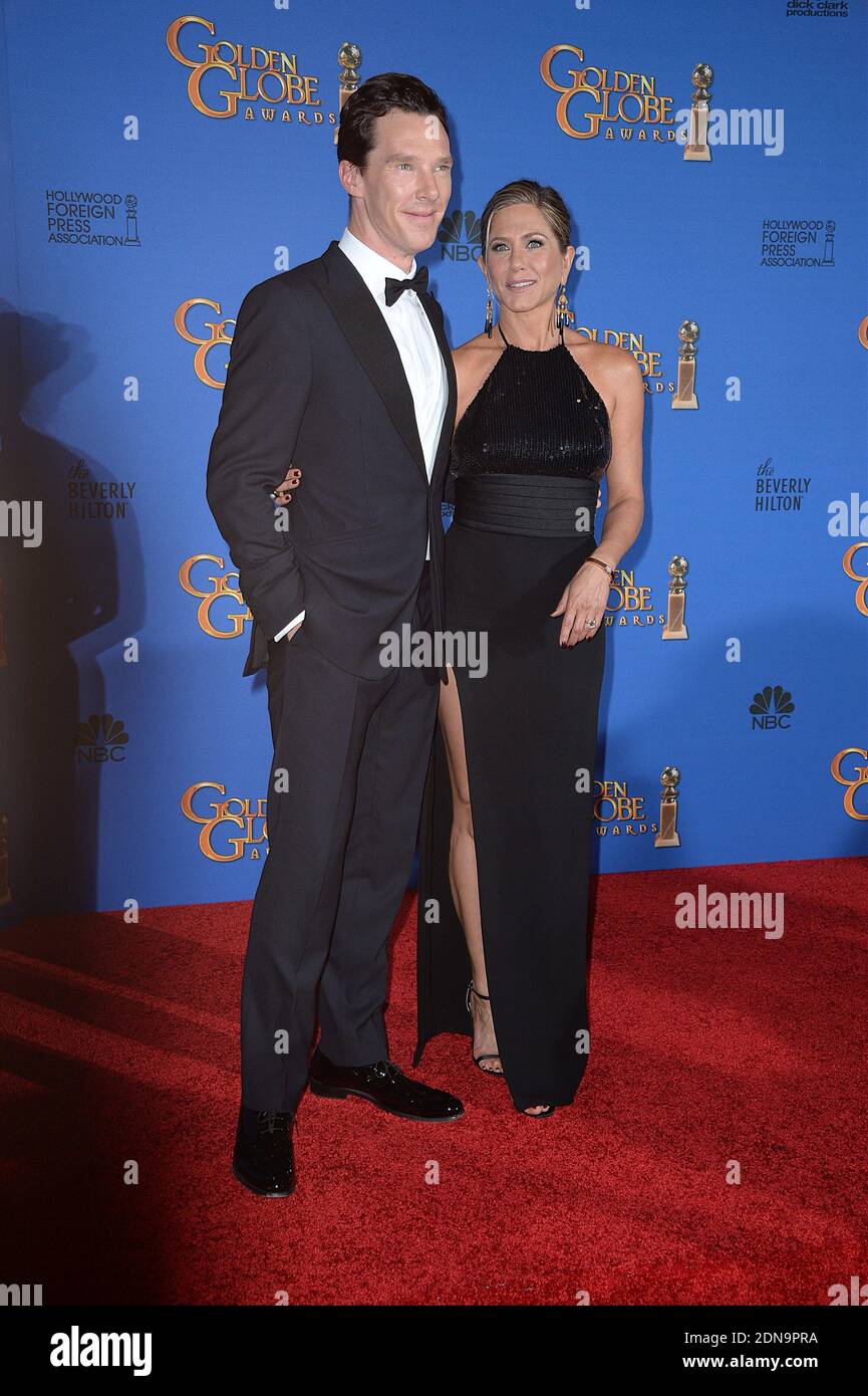 Benedict Cumberbatch (L) and Jennifer Aniston posing in the press room ...