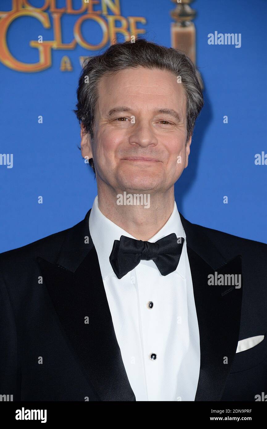 Colin Firth posing in the press room at the 72nd annual Golden Globe ...