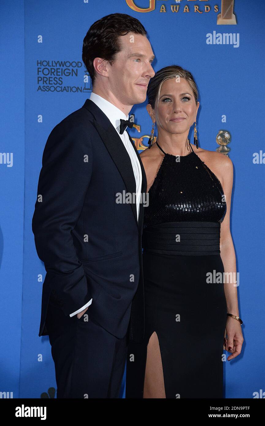 Benedict Cumberbatch (L) and Jennifer Aniston posing in the press room ...