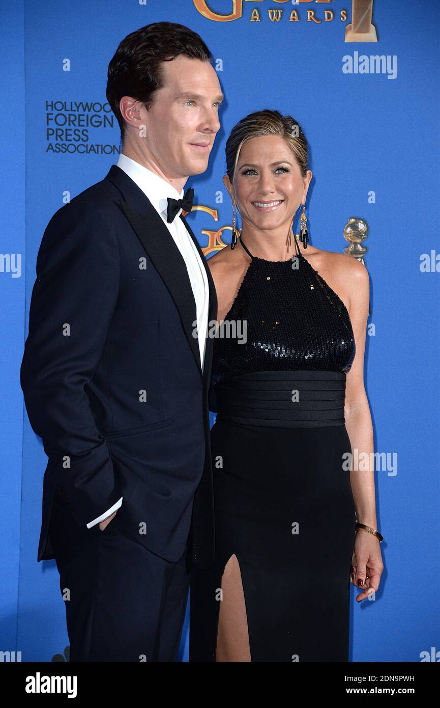 Benedict Cumberbatch (L) and Jennifer Aniston posing in the press room ...