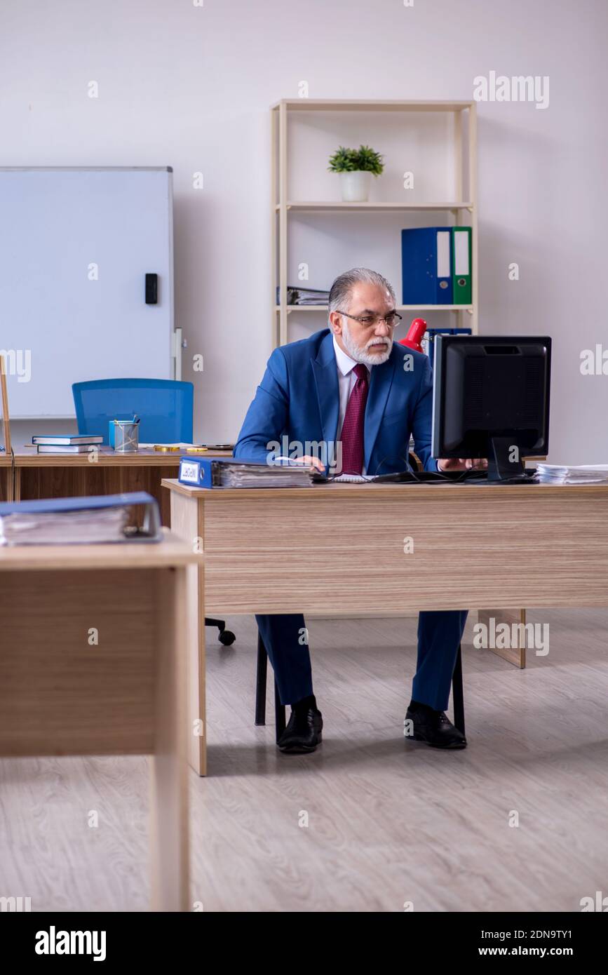Male boss employee working in the office Stock Photo - Alamy