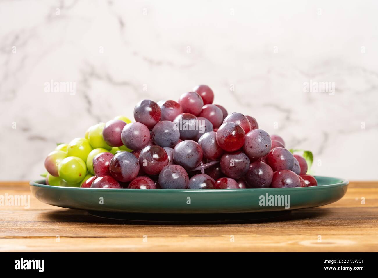 side view artificial grapes horizontal composition Stock Photo - Alamy